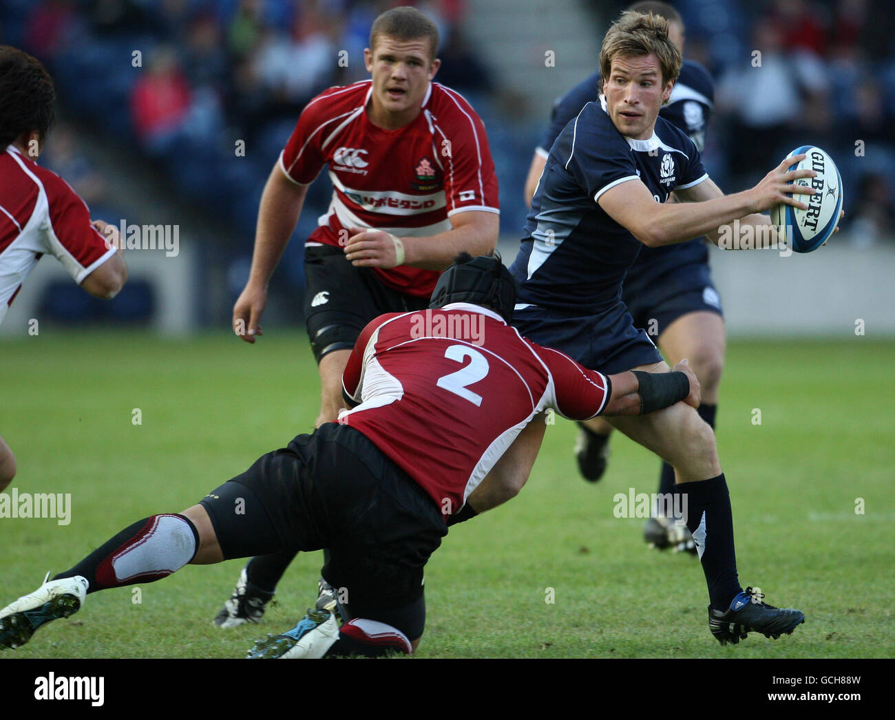Scotland's Phil Godman and Japan's Hirotaka Hirahara during the match ...