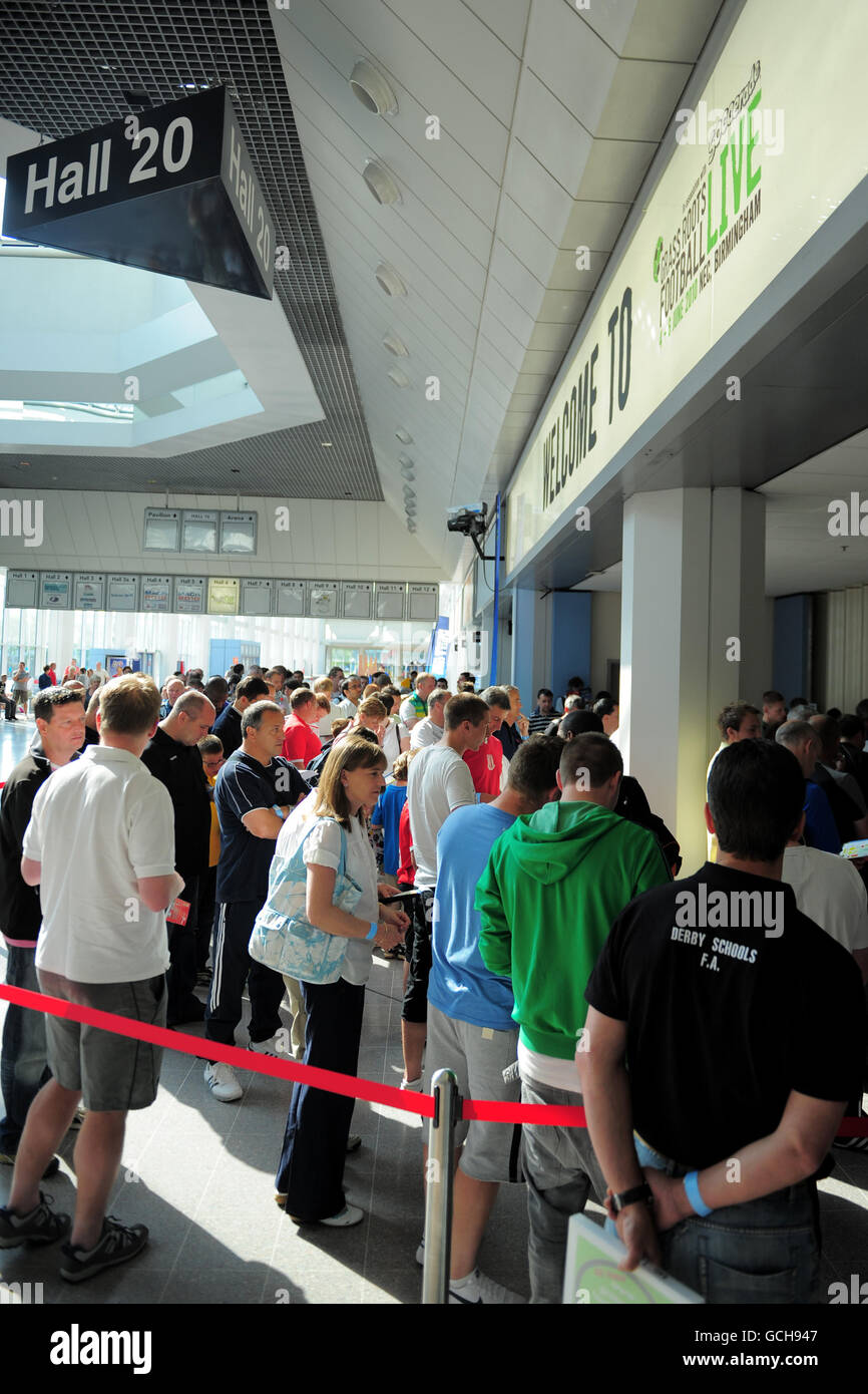 Fans queue up outside as they wait to enter Grass Roots Football Live ...