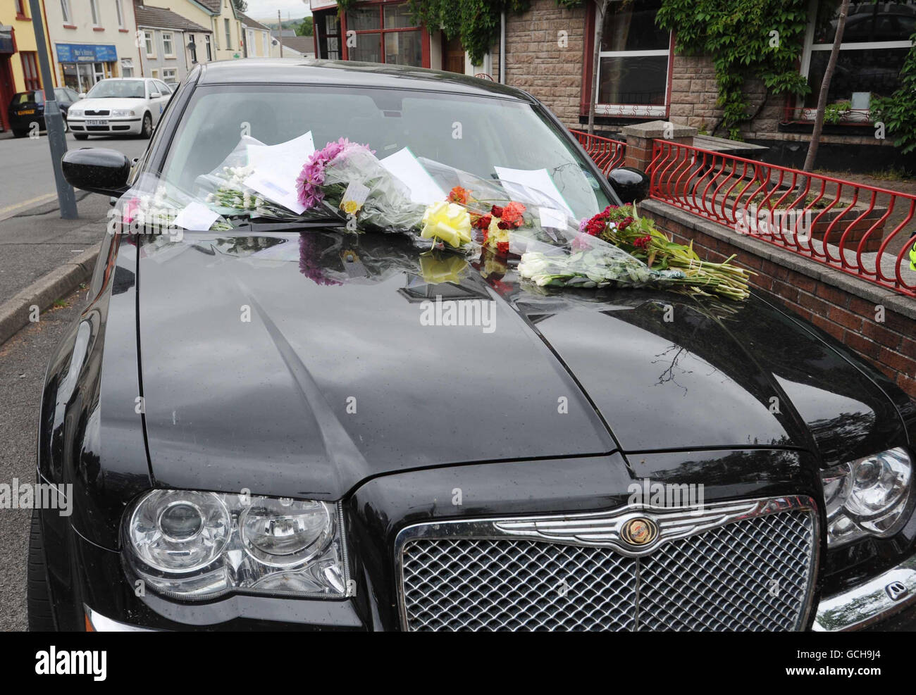 Floral tributes left on the car of Stuart Cable outside the Welsh Harp ...