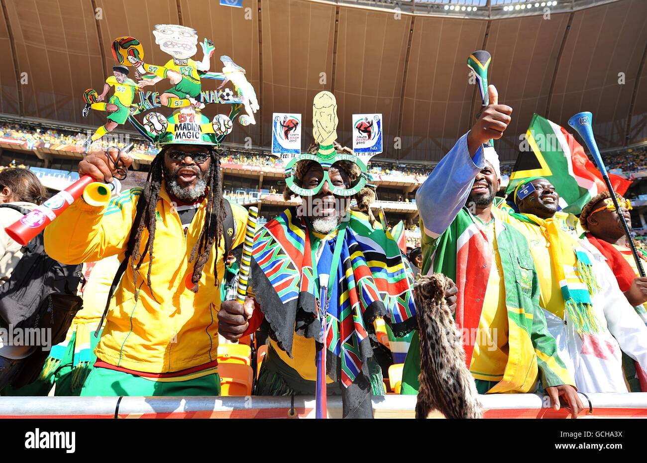 Fans gather inside the Soccer City stadium for the opening ceremony ...