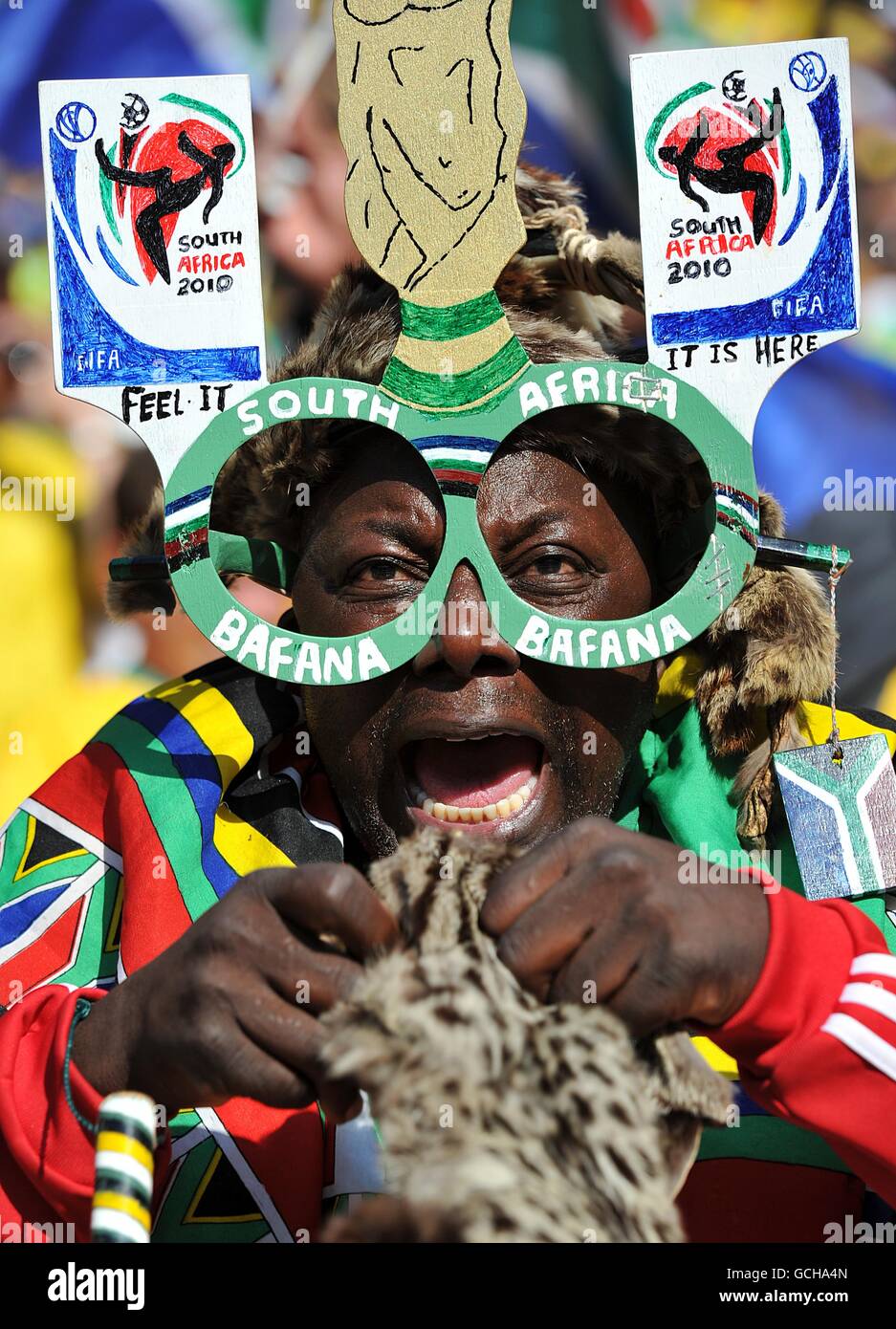 Fans gather inside the Soccer City stadium for the opening ceremony ...