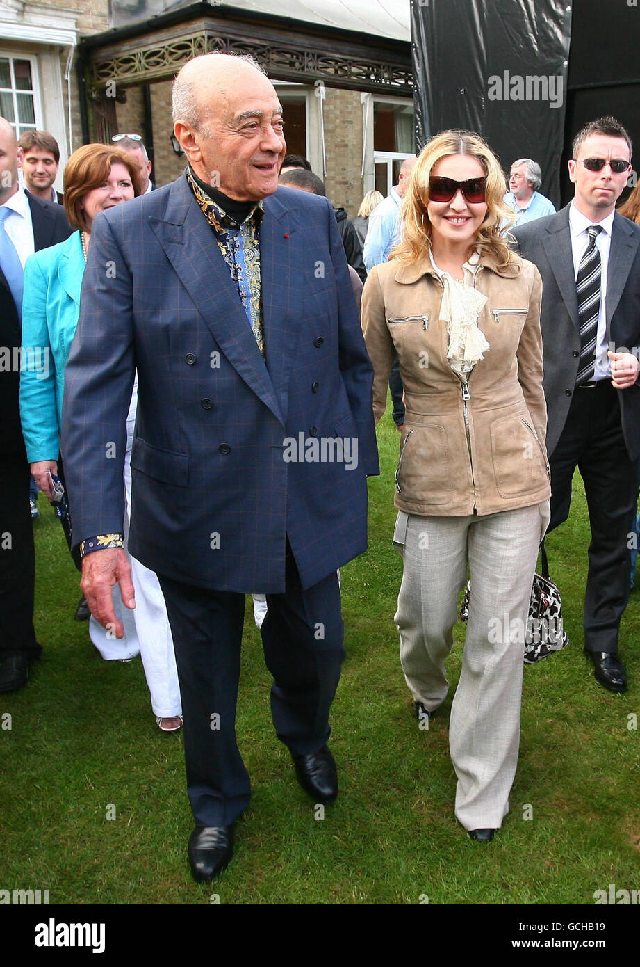 Madonna is greeted by Mohamed Al Fayed (left) as she arrives at The New ...