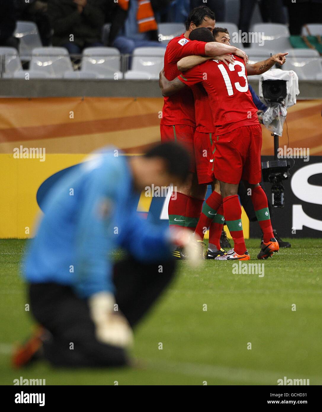 Portugal's Sabrosa Simao (pointing) celebrates scoring his sides second ...