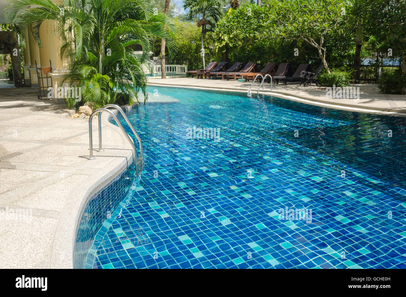 beautiful swimming pool in tropical resort Stock Photo - Alamy