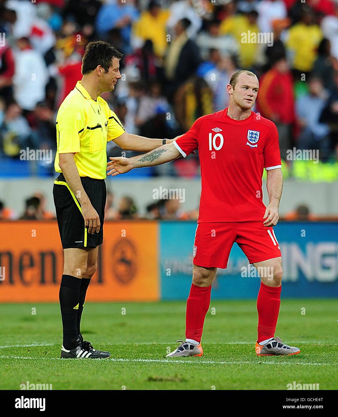 England's Wayne Rooney (right) has a chat with referee Wolfgang Stark ...