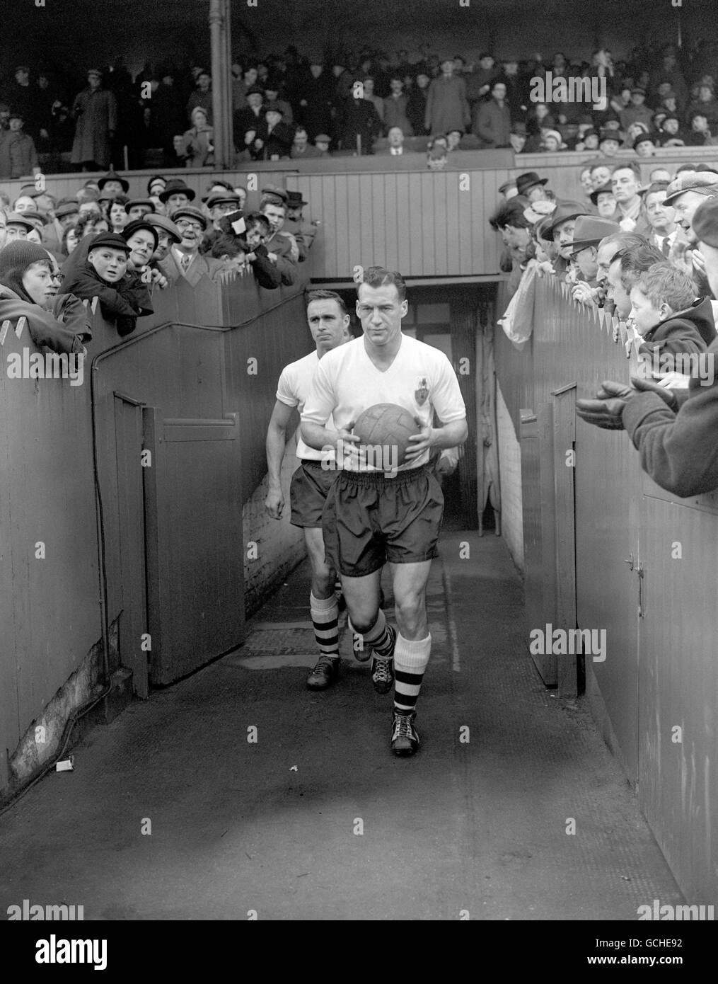 Nat Lofthouse, captain of Bolton Wanderers, leads out his team Stock ...