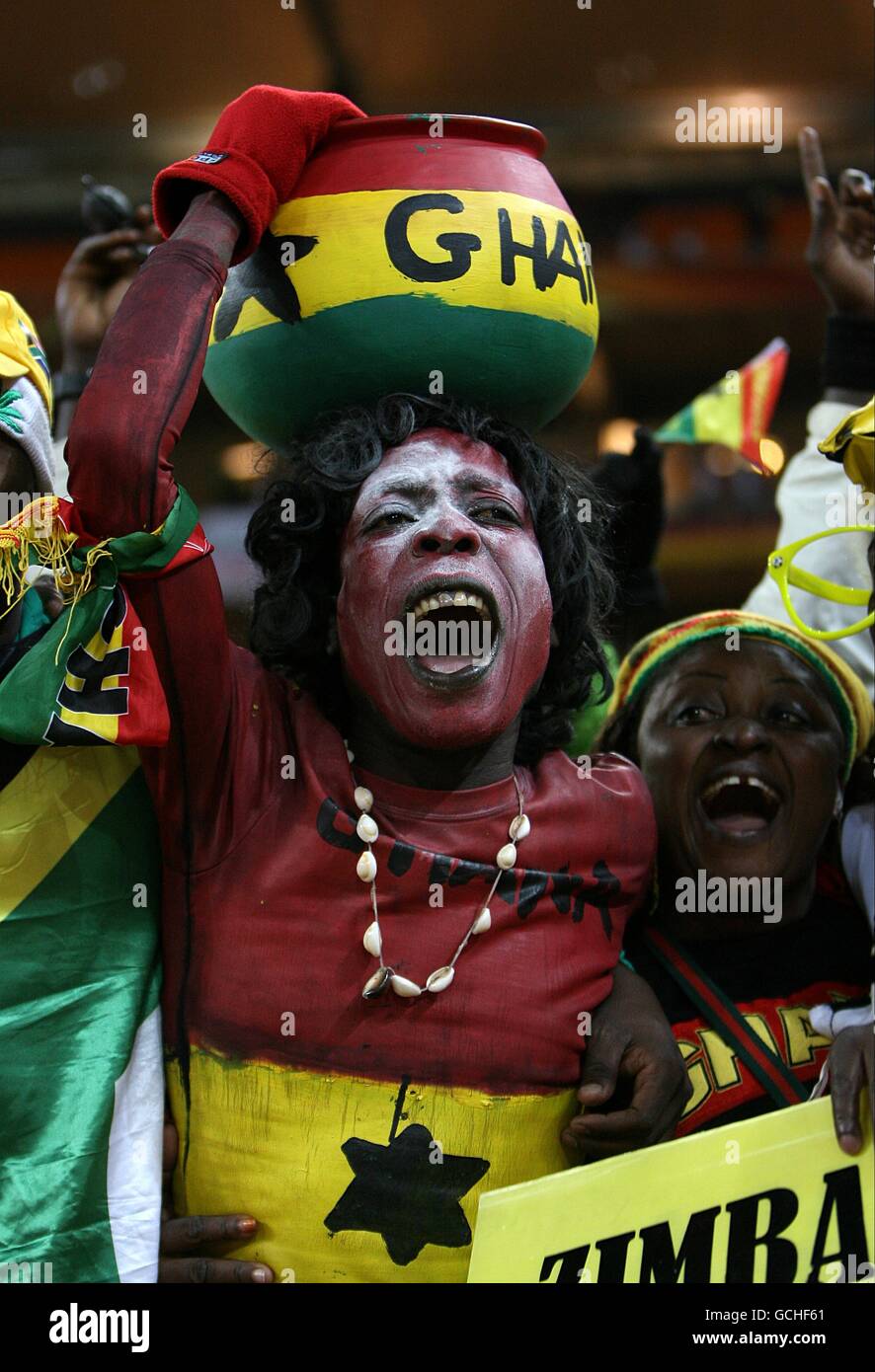 Ghana fans celebrate their side progressing to the next round in the ...