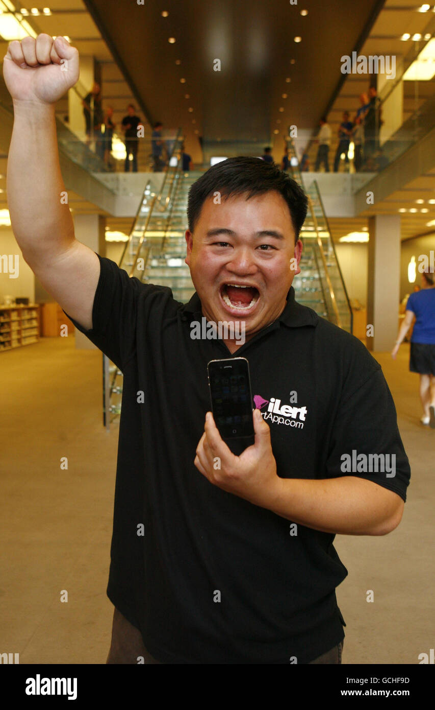 Alex Lee, 27, from Dubai, the first customer in the queue, purchases ...