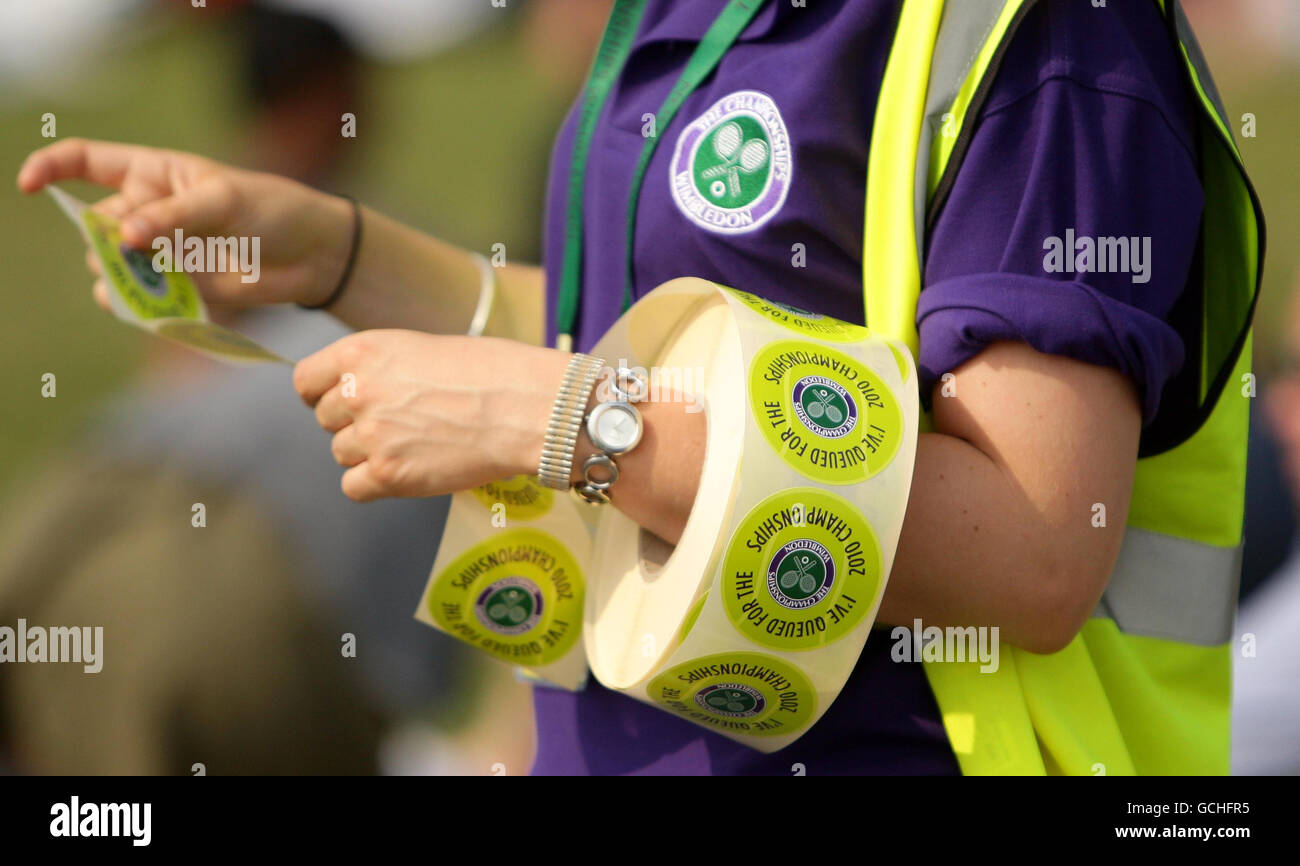 Wimbledon stickers are handed out in Wimbledon Park during Day Six of ...
