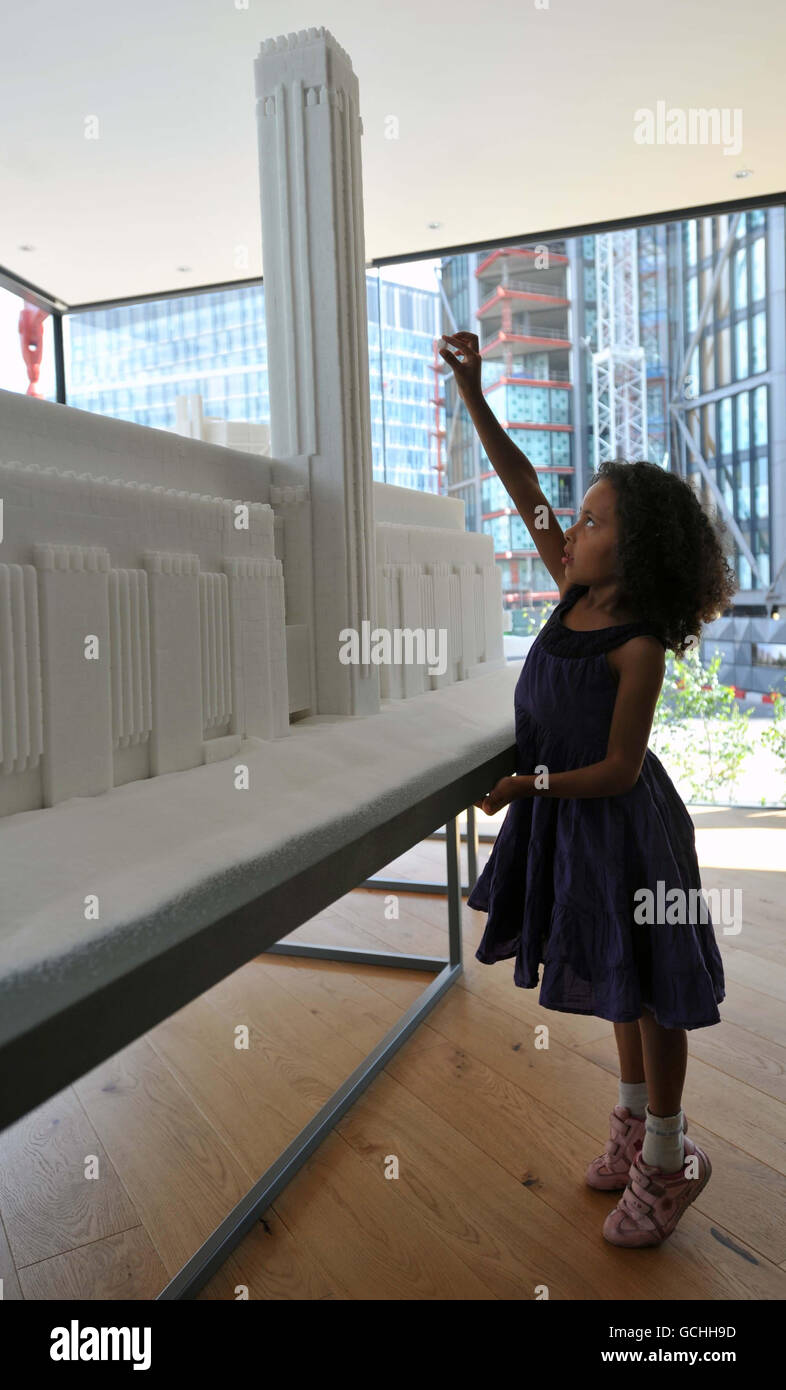 Six-year-old Kenya Lord adds a sugar cube Belfast sculptor Brendan ...