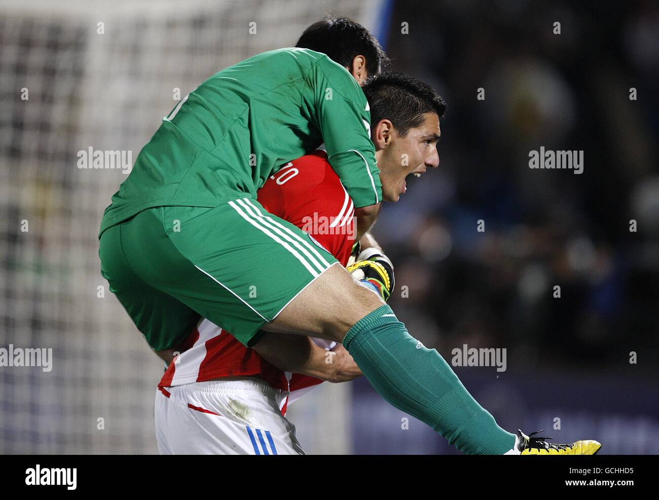 Paraguay's Oscar Cardozo (right) celebrates after scoring the winning ...