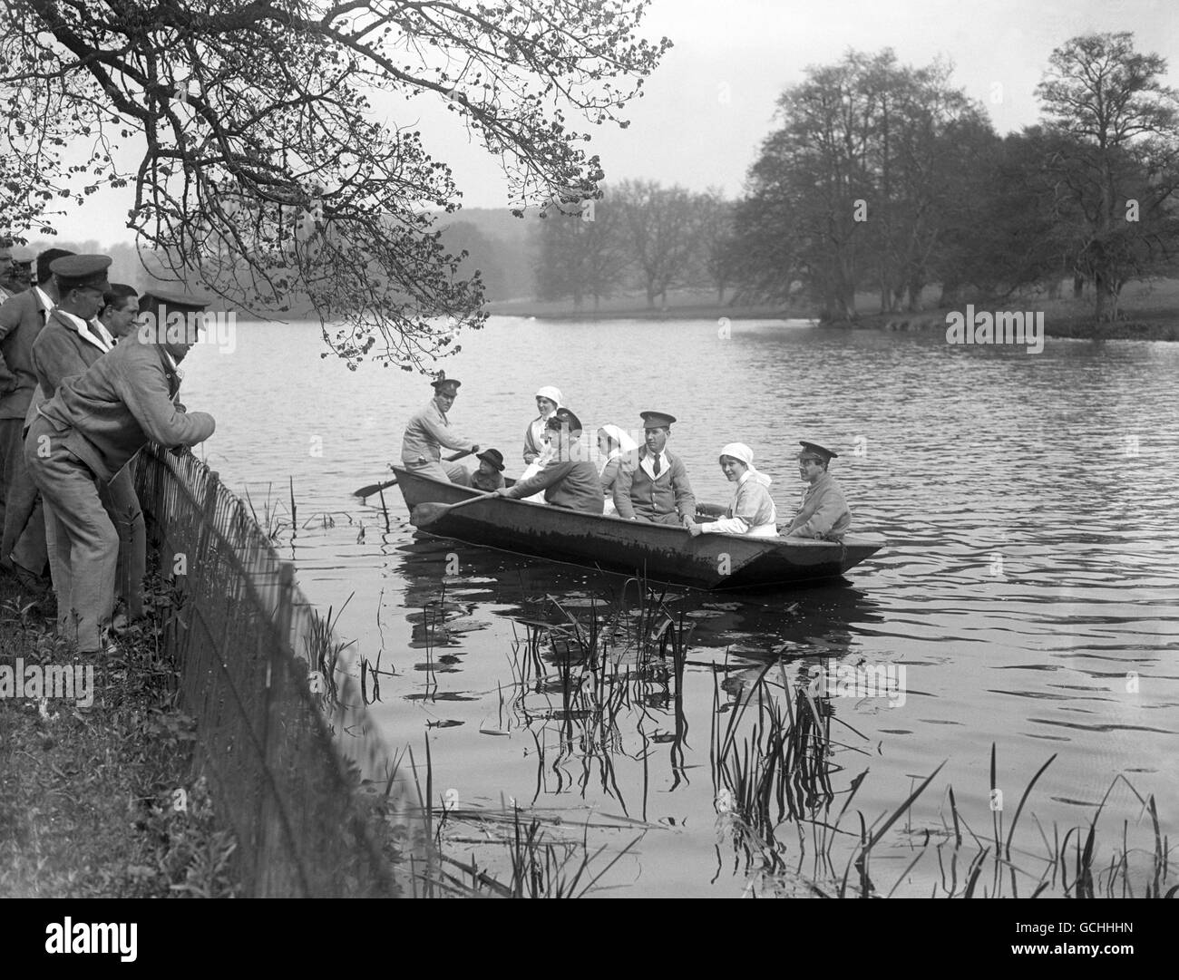 CONVALESCENT SOLDIERS AND THEIR NURSES RELAX ON THE LAKE IN THE GROUNDS ...
