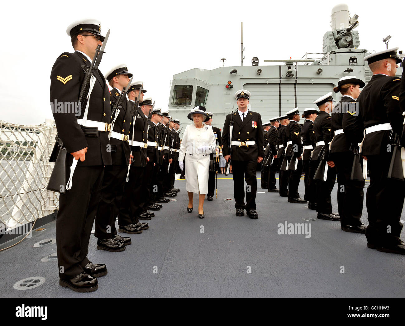 Britain's Queen Elizabeth II inspects a Guard of Honour aboard HMCS St ...