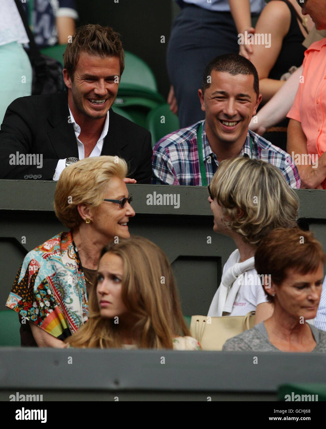 David Beckham speaks with spectators as Kim Sears and Judy Murray ...