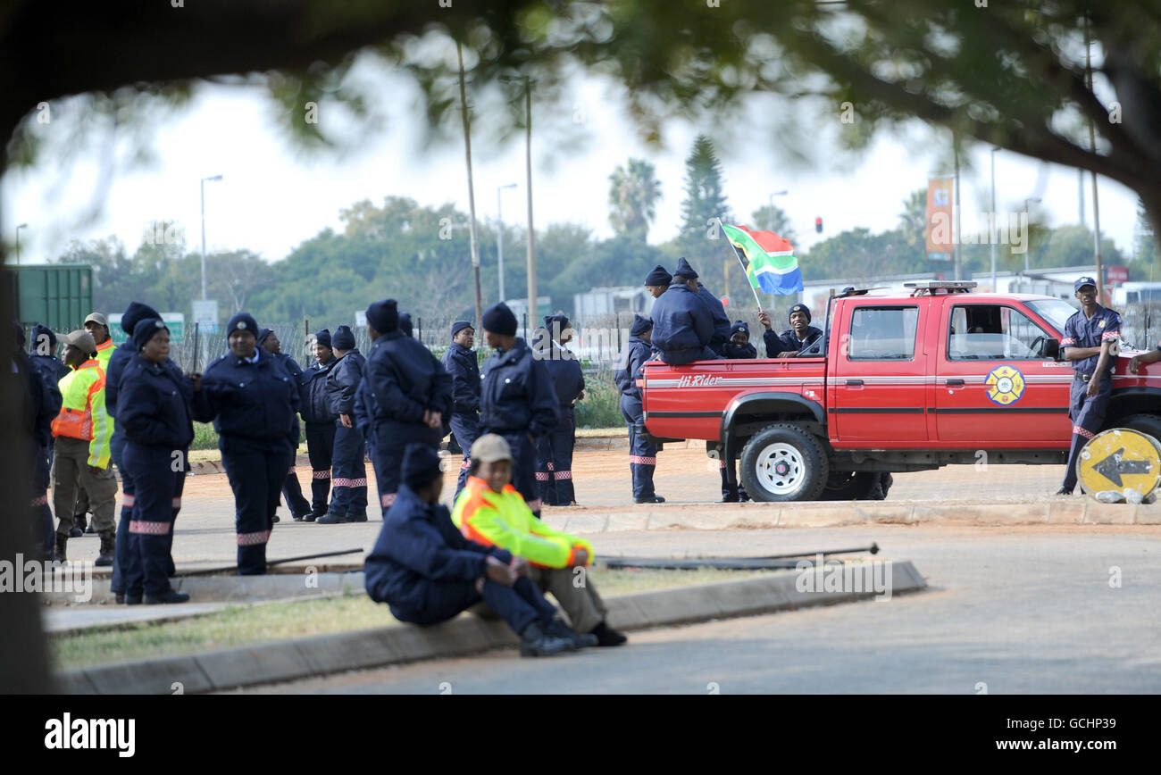 Police officers relax following a passing out ceremony in rustenburg hi ...