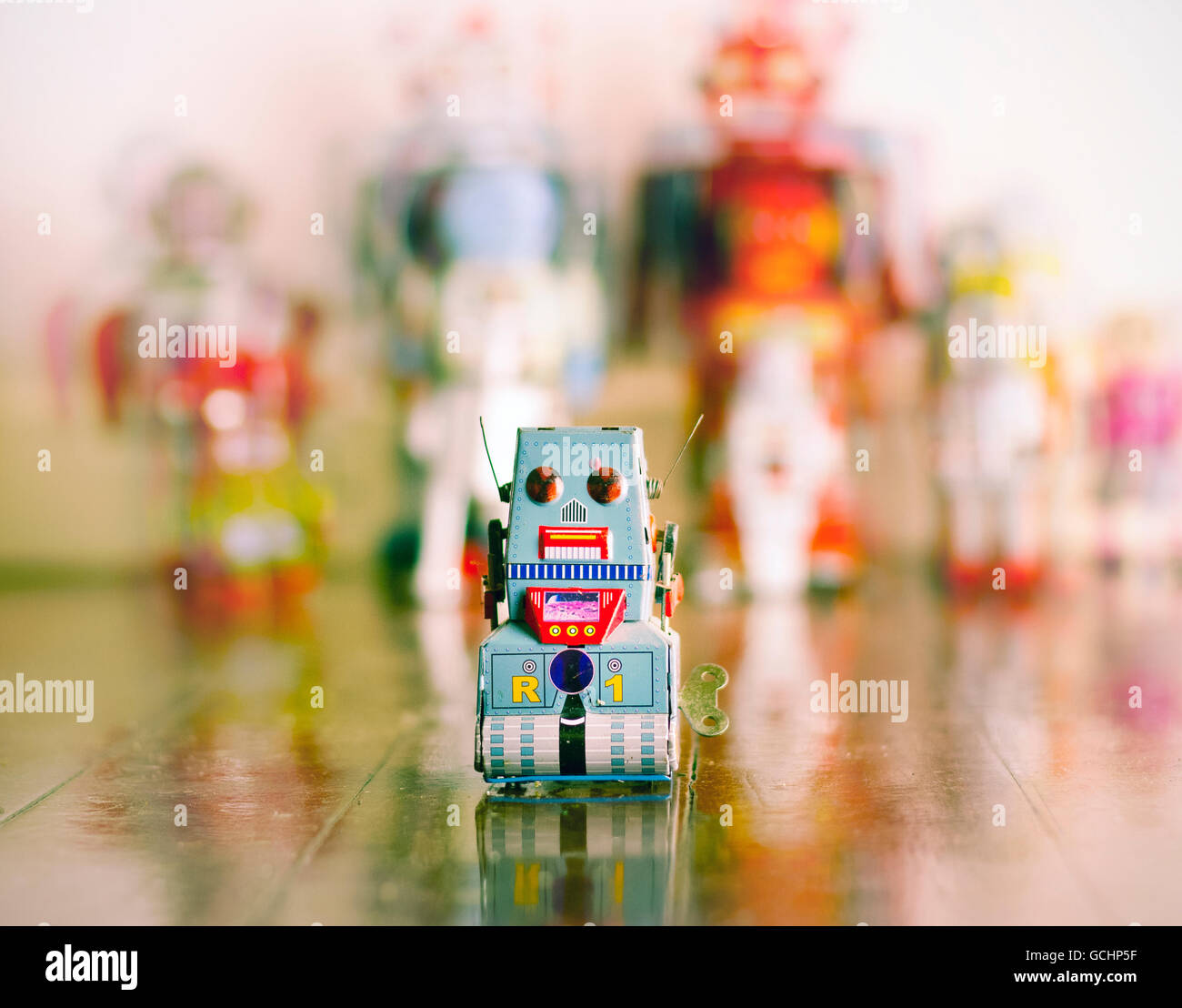 little robot toy on old wooden floor Stock Photo - Alamy