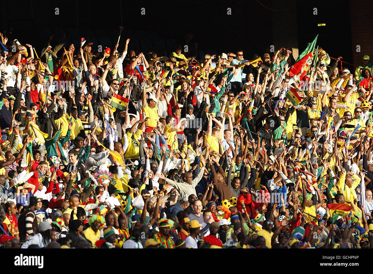 Ghana fans doing a mexican wave in the stands hi-res stock photography ...