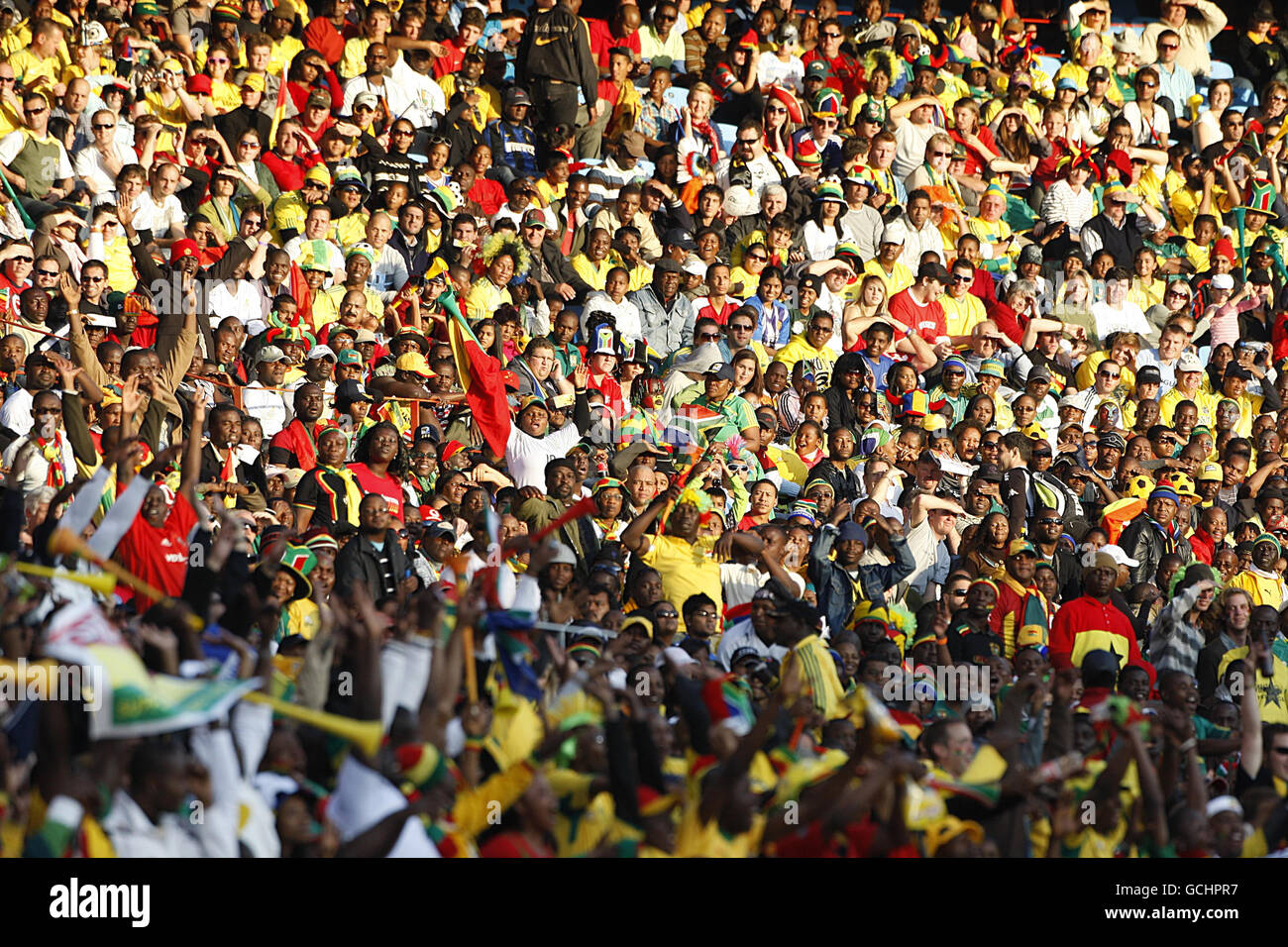 Ghana fans cheer on side in stands hi-res stock photography and images ...