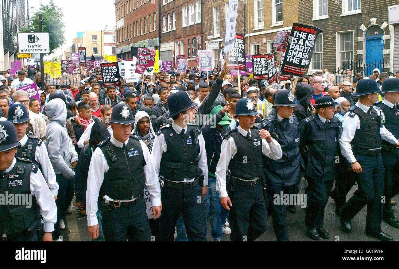 Police with demonstrators marching towards Commercial Road, East London ...