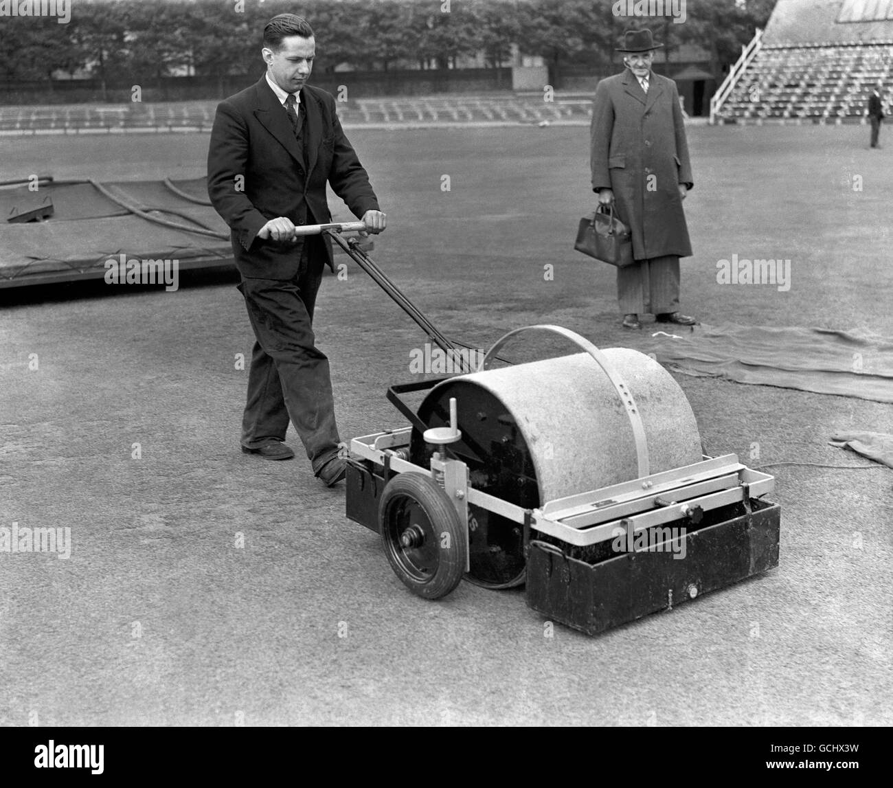 Cricket - New technology. The groundsman uses a new device to dry the ...