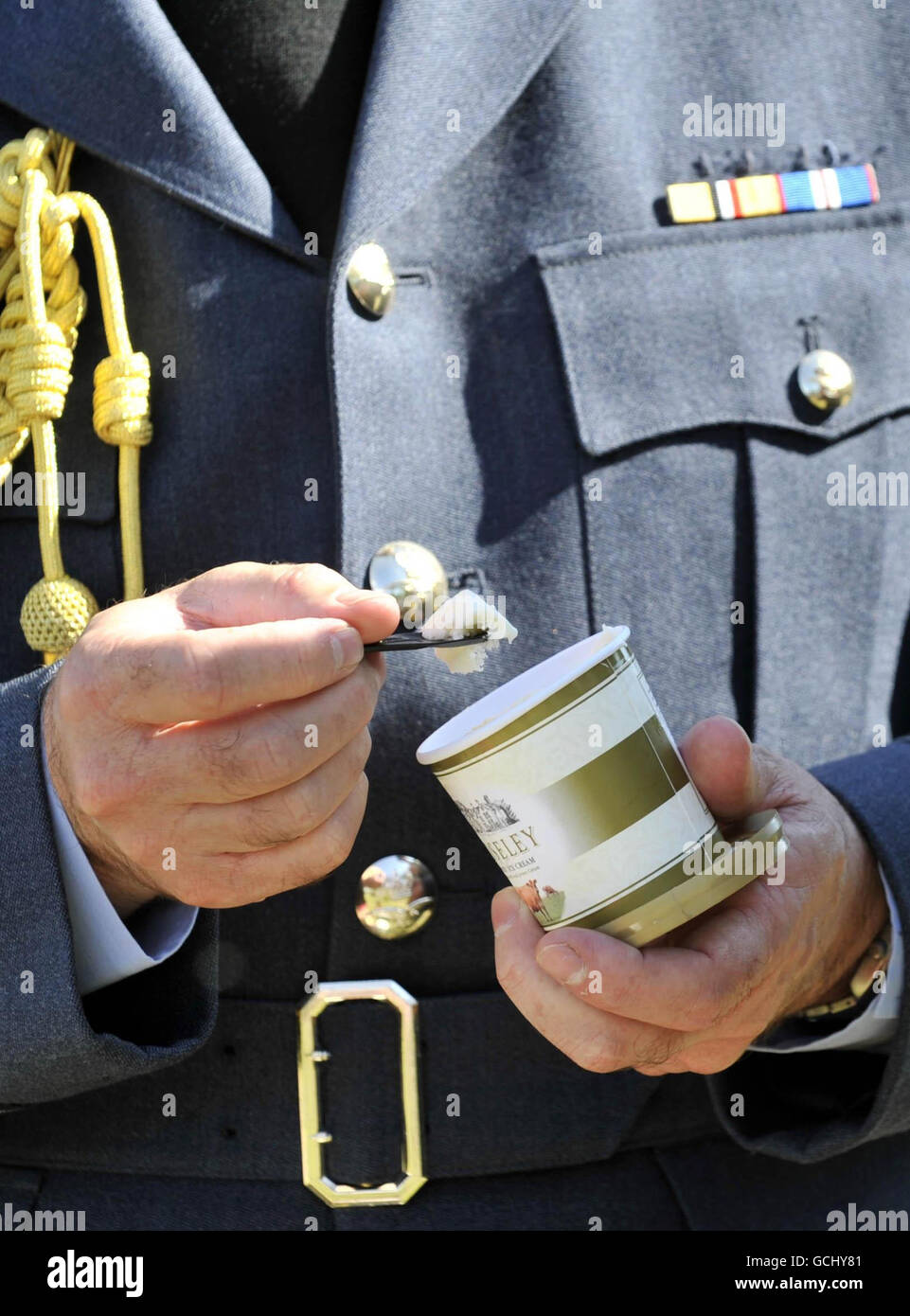 A guest enjoys some ice cream during a Garden Party at Buckingham ...