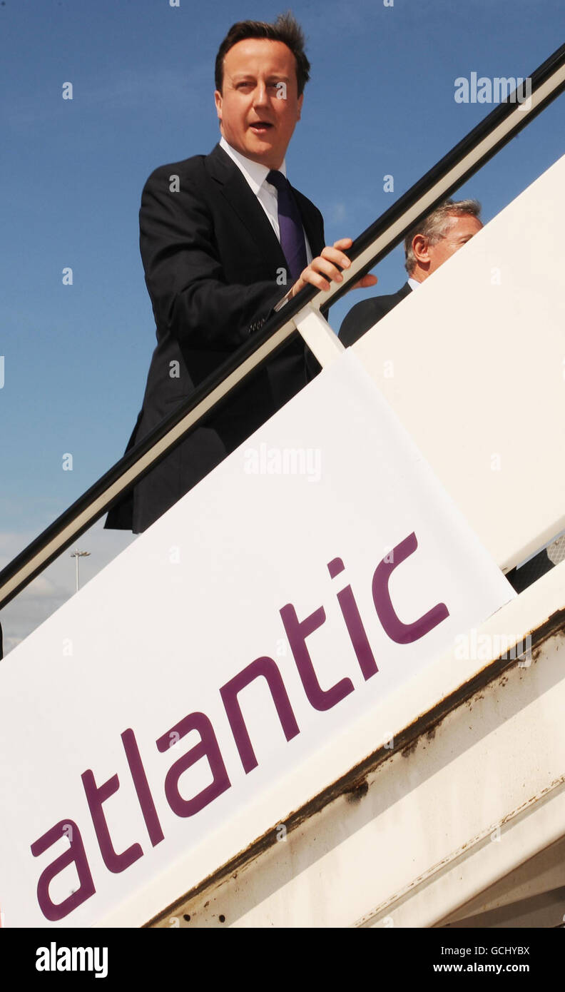 Prime Minister David Cameron boards his plane bound for Canada today ...