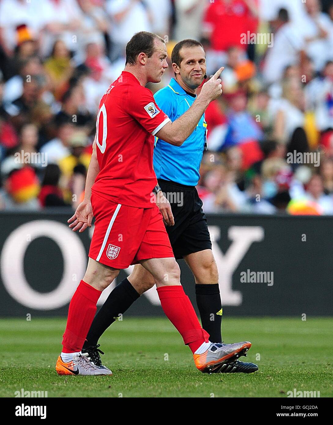 England's Wayne Rooney confronts the linesman Mauricio Espinosa as they ...