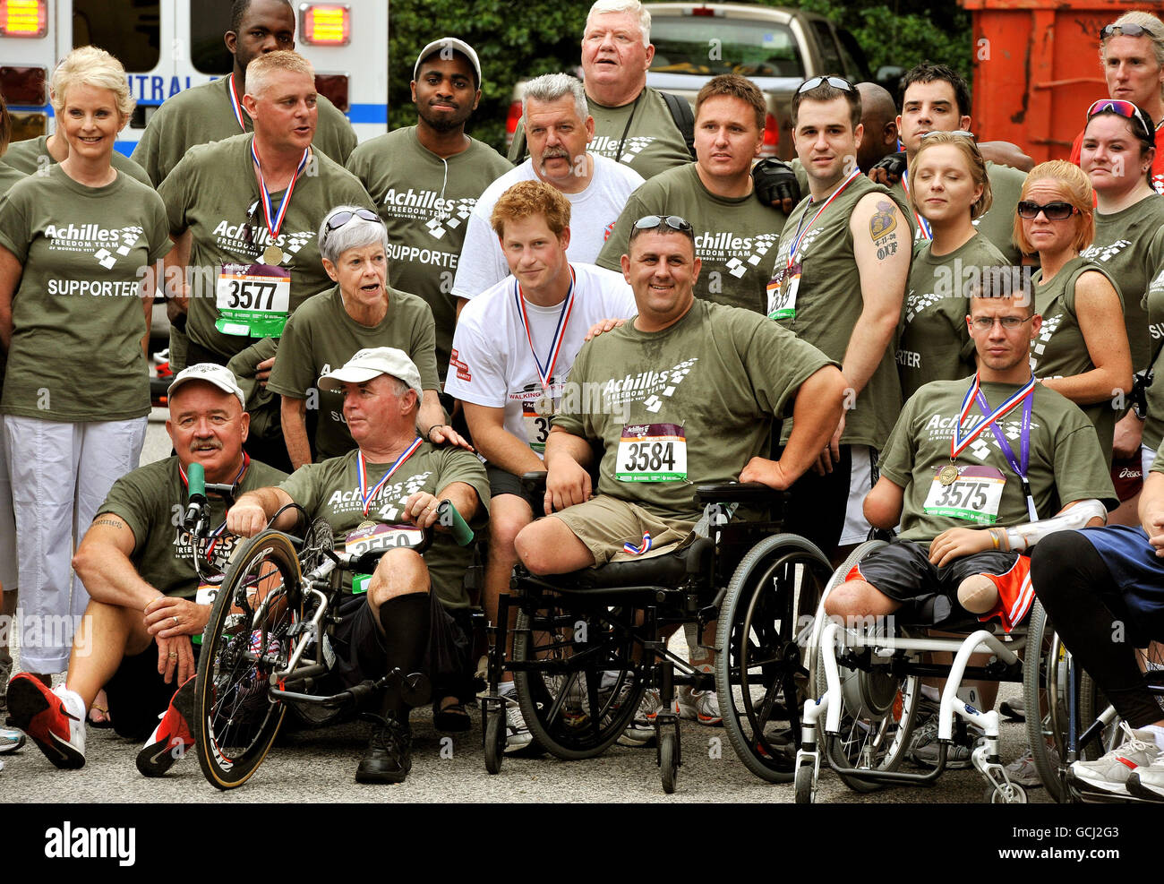 Prince Harry poses with army veterans after a charity run through ...