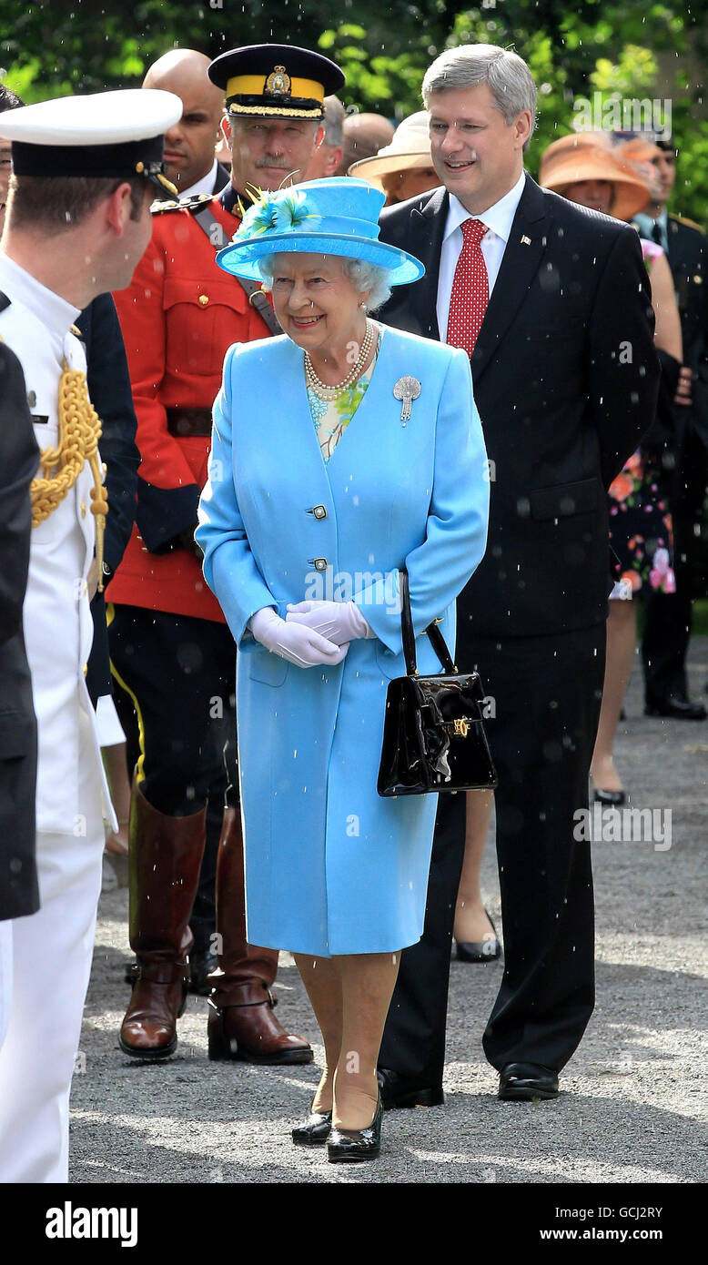Queen Elizabeth II, followed by Canadian Prime minister Stephen Harper ...