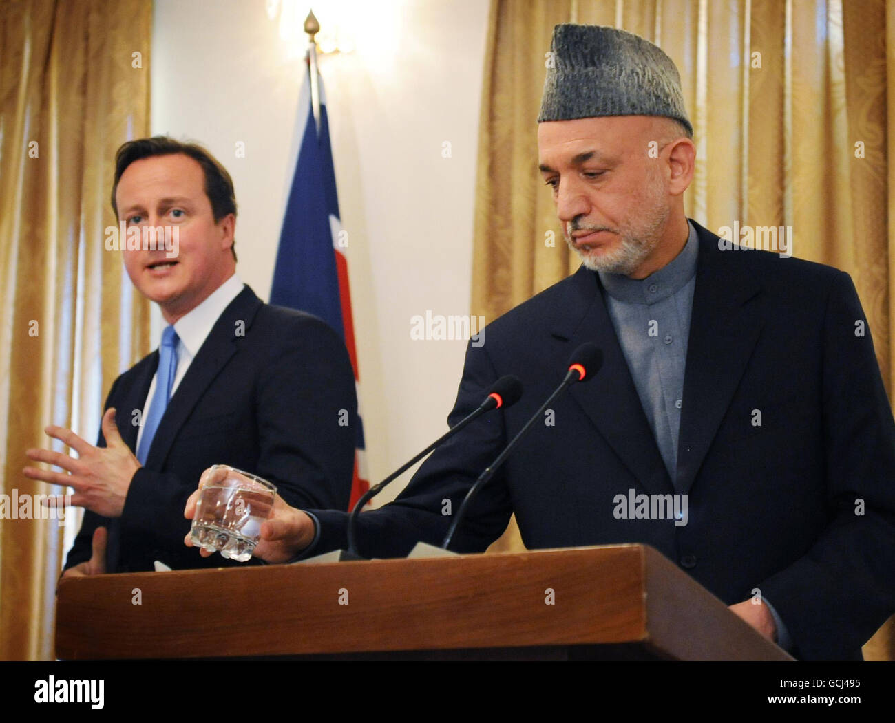 Politics afghanistan half length mid top speaking microphone lectern ...