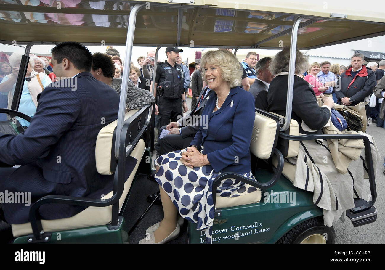 The Duchess of Cornwall rides on a golf buggy between her engagements ...