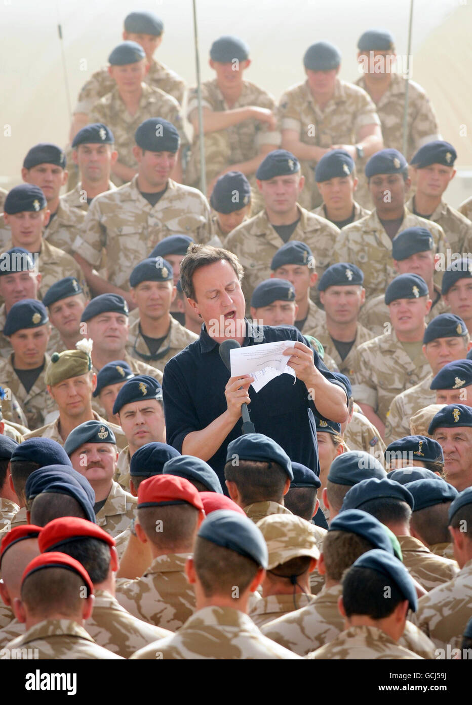 Prime Minister David Cameron reads out a message to British soldiers ...