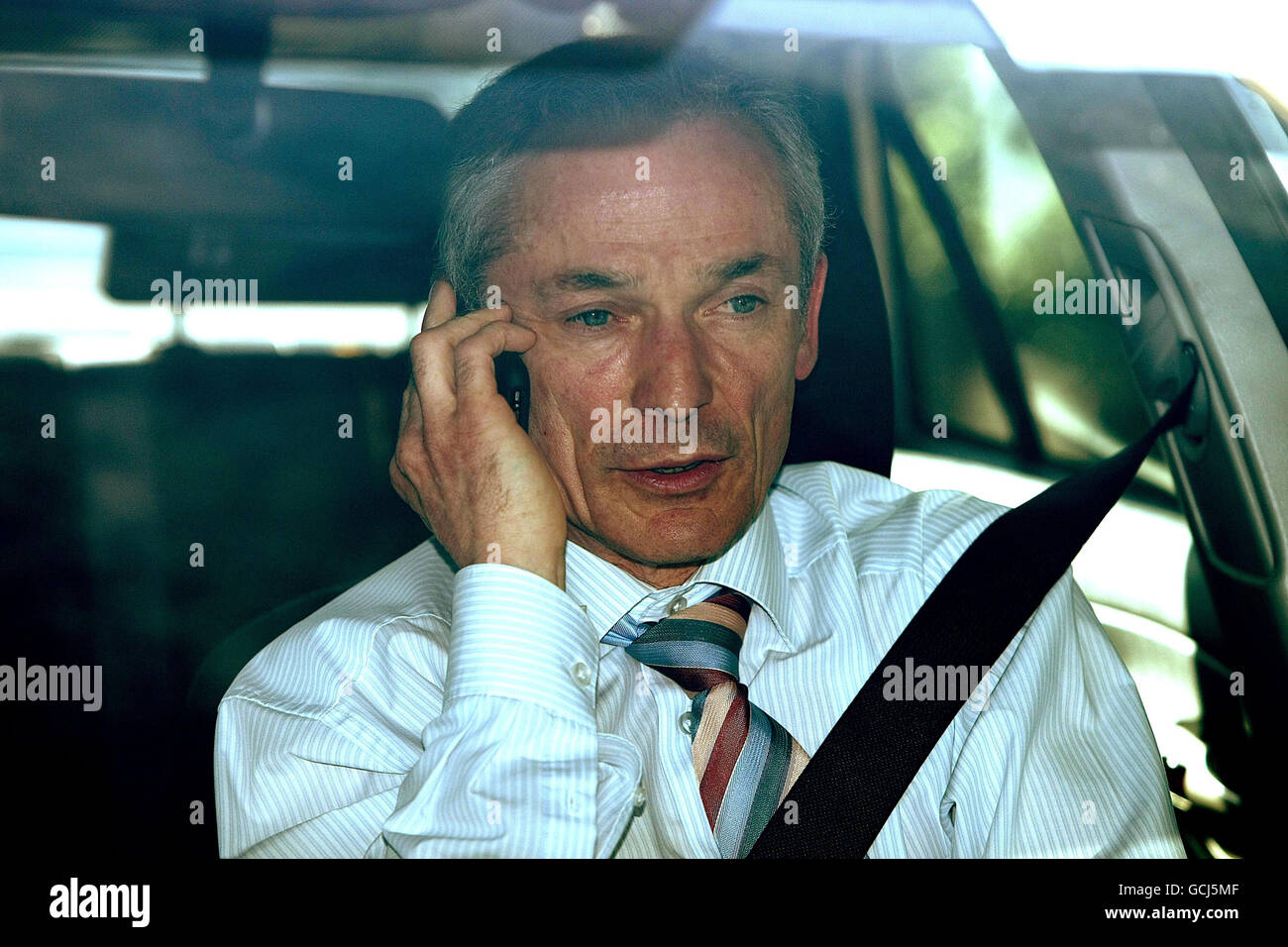 Richard Bruton on the phone outside RTE Studios, Dublin, after Fine ...