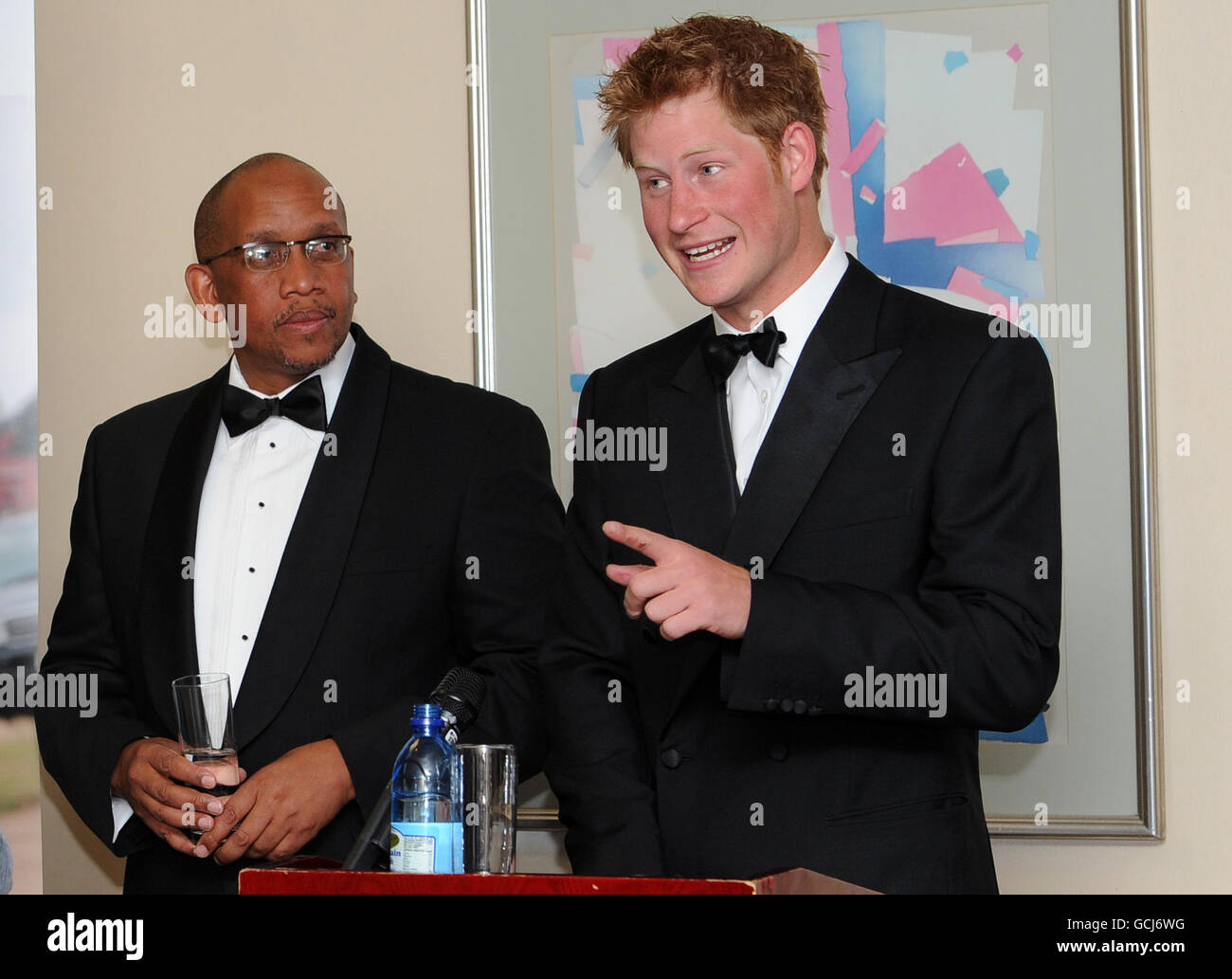 Prince Seeiso looks on as Prince Harry gives a speech while hosting a ...