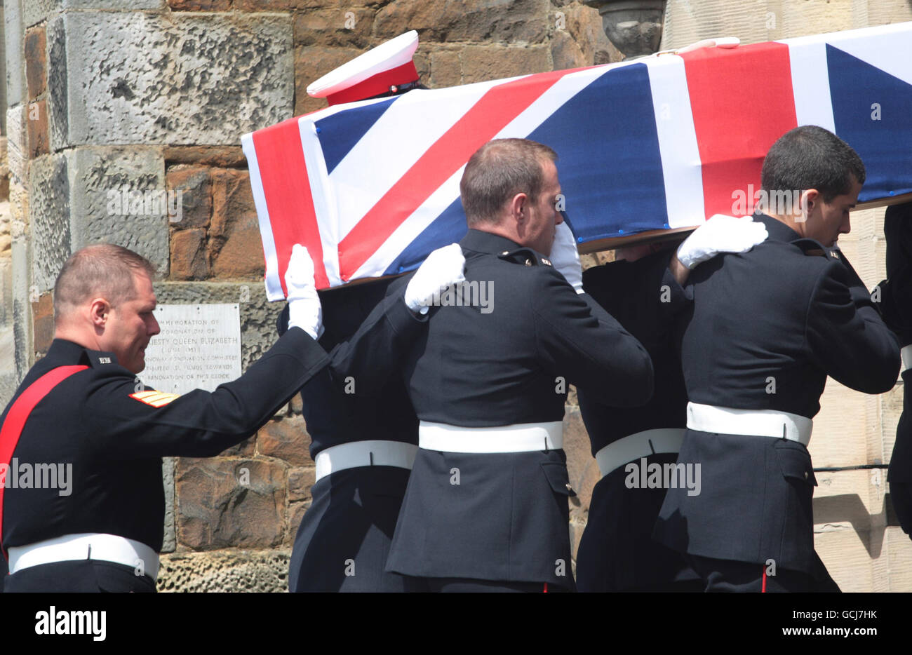 The coffin of Royal Marine Corporal Stephen Walker, is carried for his ...