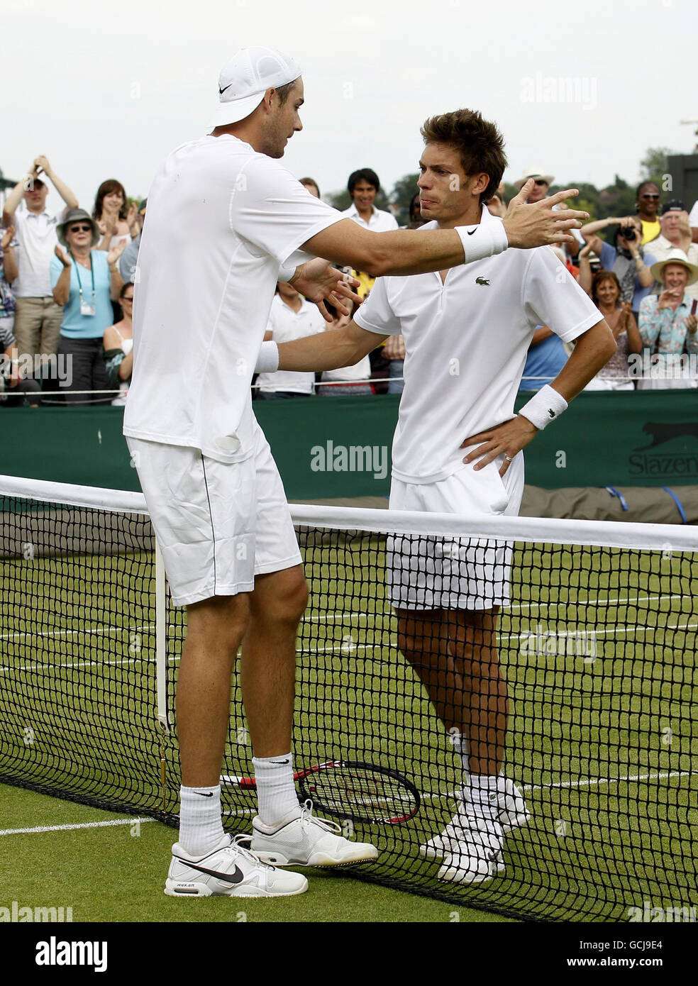 USA's John Isner consoles France's Nicolas Mahut (right) after their ...