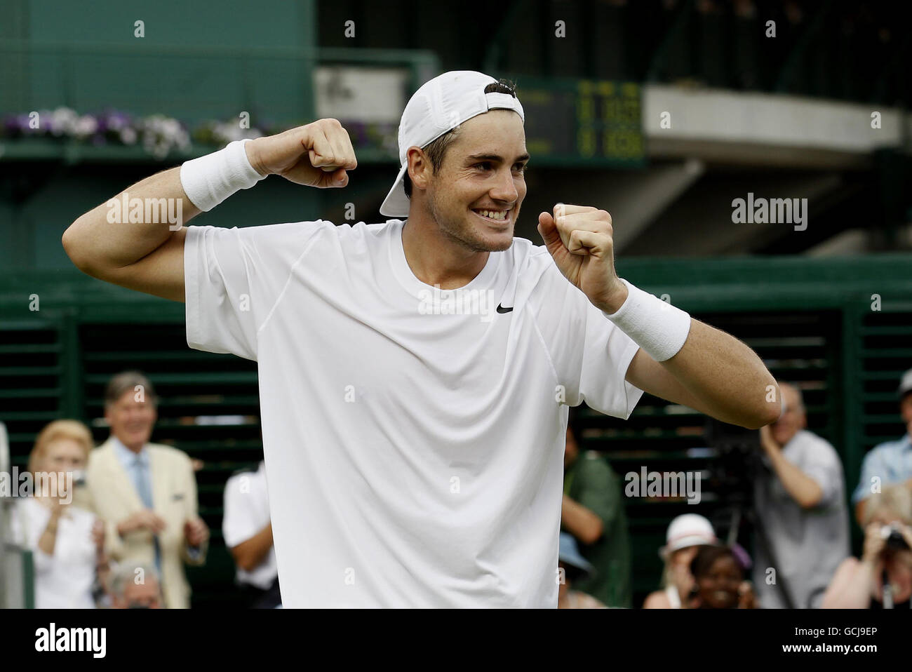 USA's John Isner celebrates victory over France's Nicolas Mahut in ...