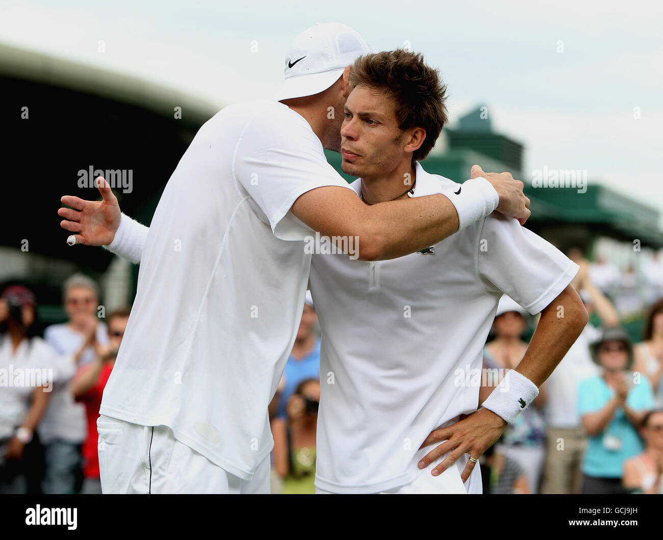 USA's John Isner celebrates victory over France's Nicolas Mahut (right ...