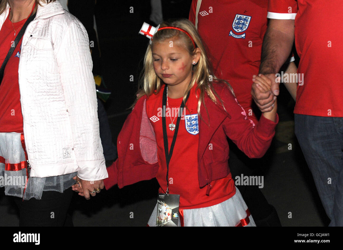 England fans appear dejected as they leave the stadium in Bloemfontein ...