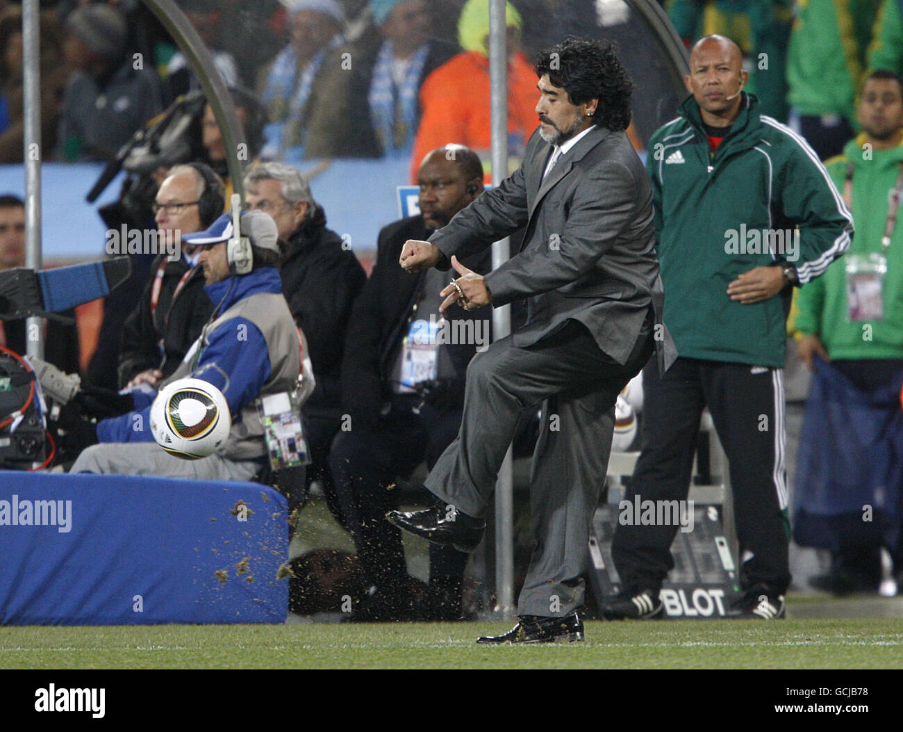 Argentina coach diego maradona kicks the ball on the touchline hi-res stock photography and ...