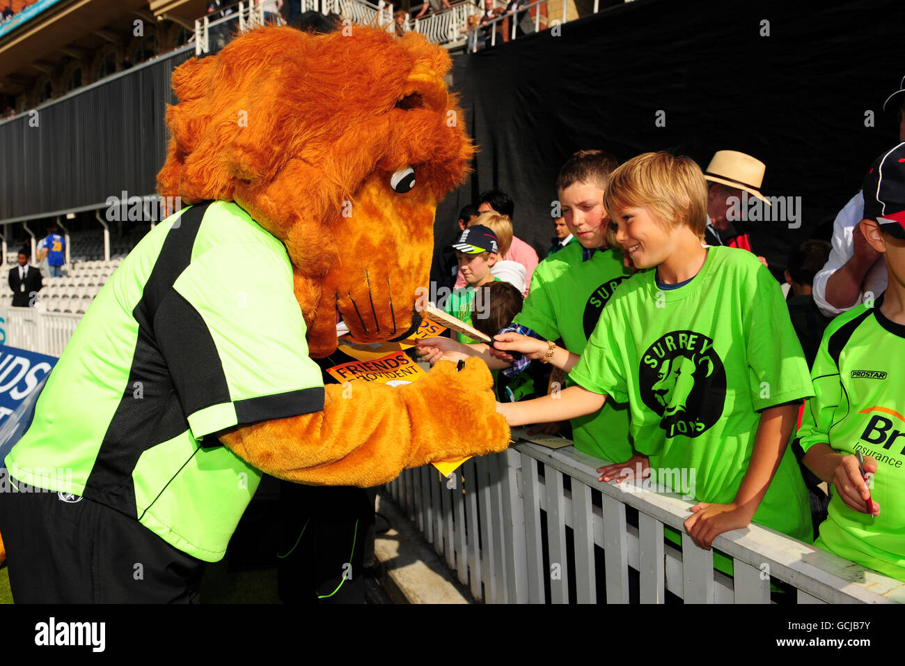 Surrey mascot Ceasar the Lion signs autographs for fans after the game ...