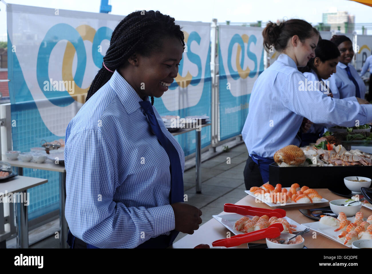 Staff serving guests the buffet on the Roof Terrace at the Brit Oval ...
