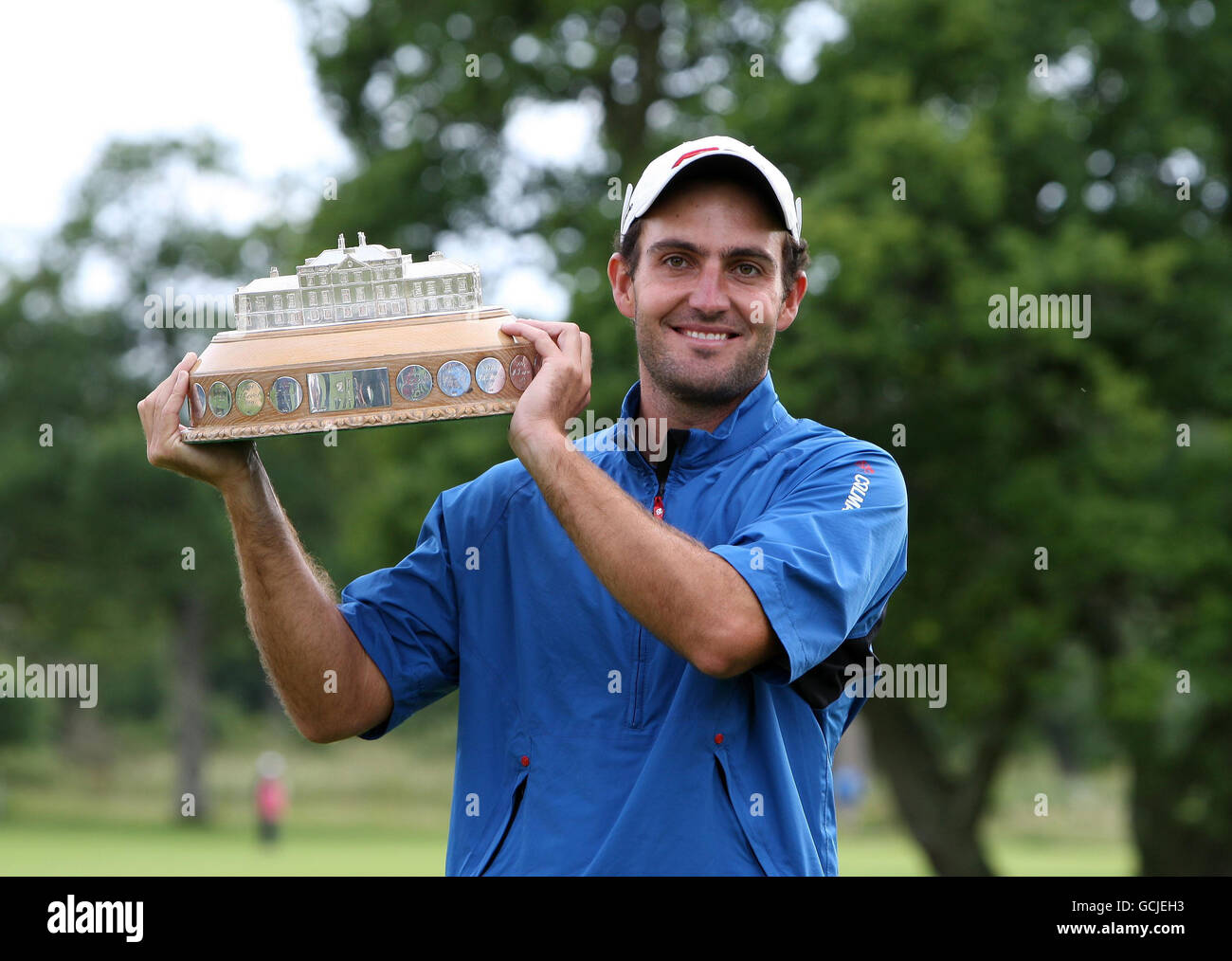 Italy's Edoardo Molinari celebrates with the trophy as he wins the ...