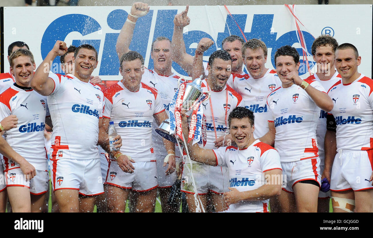 The England team celebrate with the trophy after their victory over ...