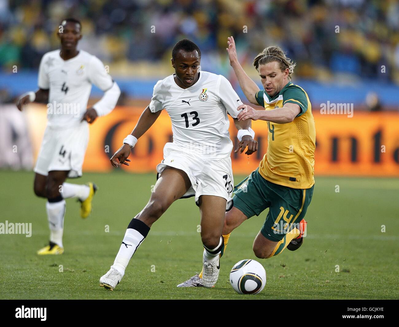 Andre ayew left australias brett holman battle for the ball hi-res ...