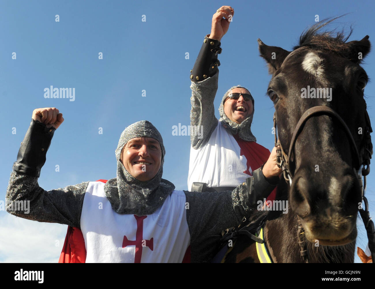 Stan Stanfield (left) and Dex Marshall pose with a police horse as ...