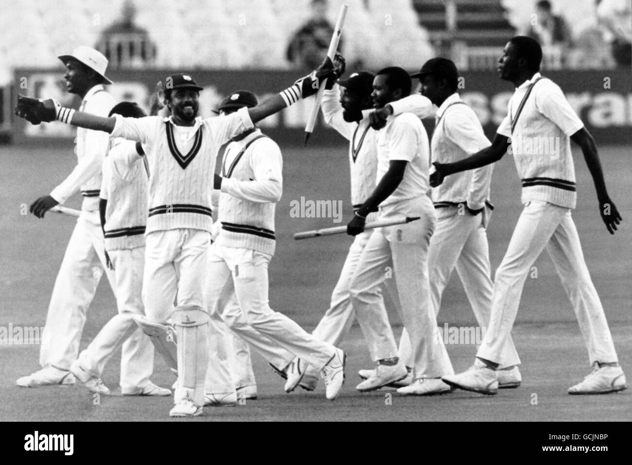 West Indies wicket-keeper Jeff Dujon (left) waves a stump at the crowd ...