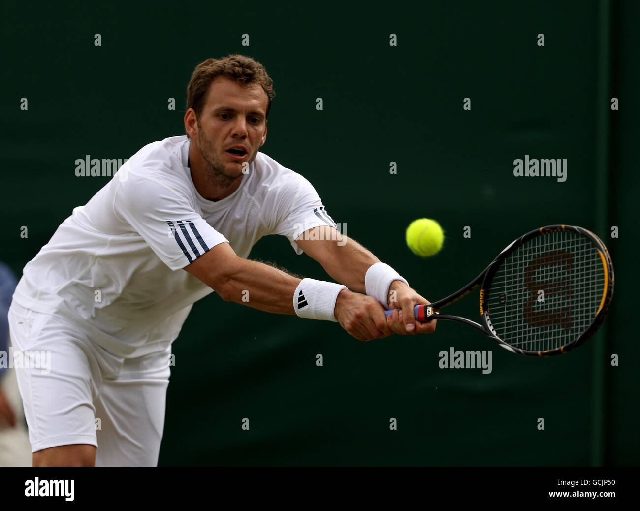 France's Paul-Henri Mathieu in action against Russia's Mikhail Youzhny ...