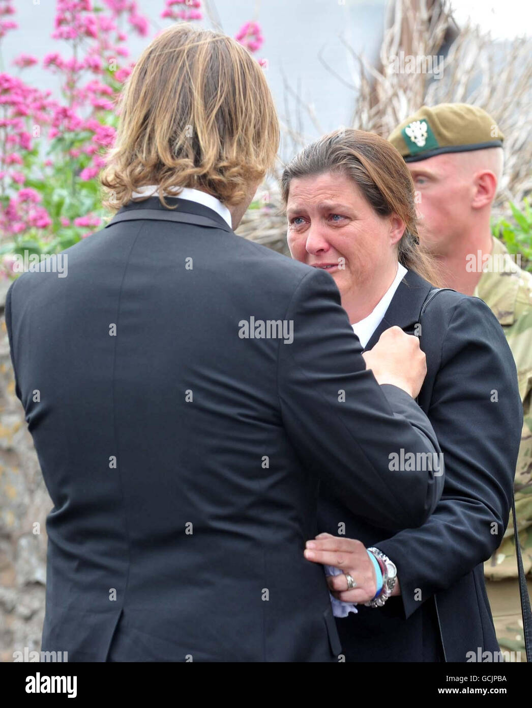 Brother Mark Cochran pins the Elizabeth Cross to Shirley Cochran's, his ...
