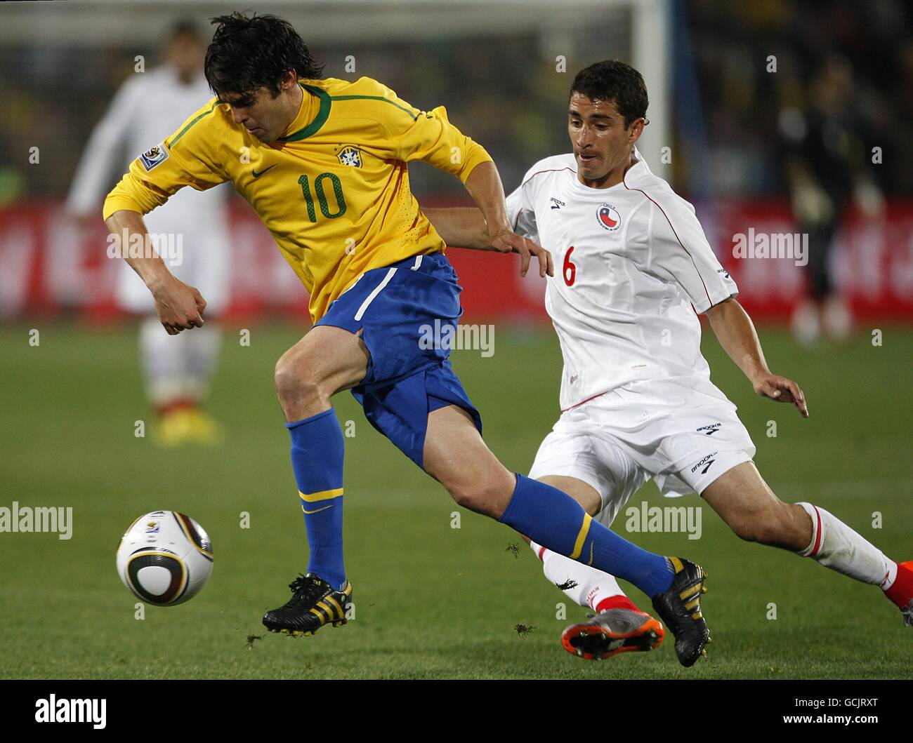 Brazil's Ricardo Kaka (left) and Chile's Carlos Carmona (right) battle ...